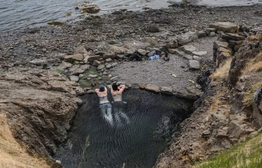 A complete guide to Hellulaug hot springs in the Westfjords – Firefly ...